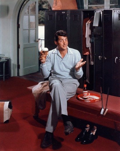 Dean Martin drinking Rheingold Beer in locker room at golf club ...
